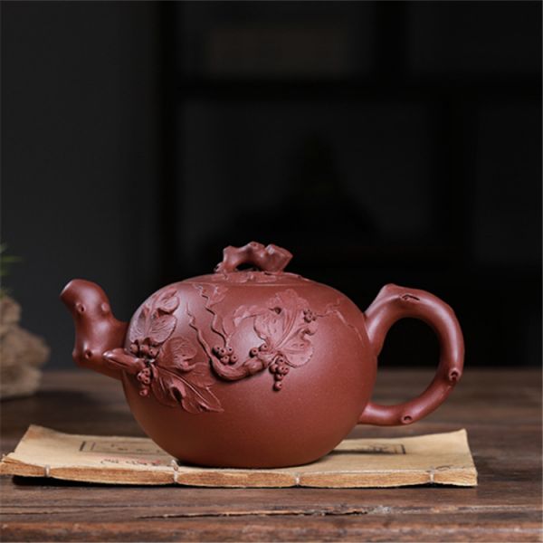 Yixing Zisha Clay Teapot Carved with Grapes and Squirrels Yixing Zisha Clay Teapot Carved with Grapes and Squirrels